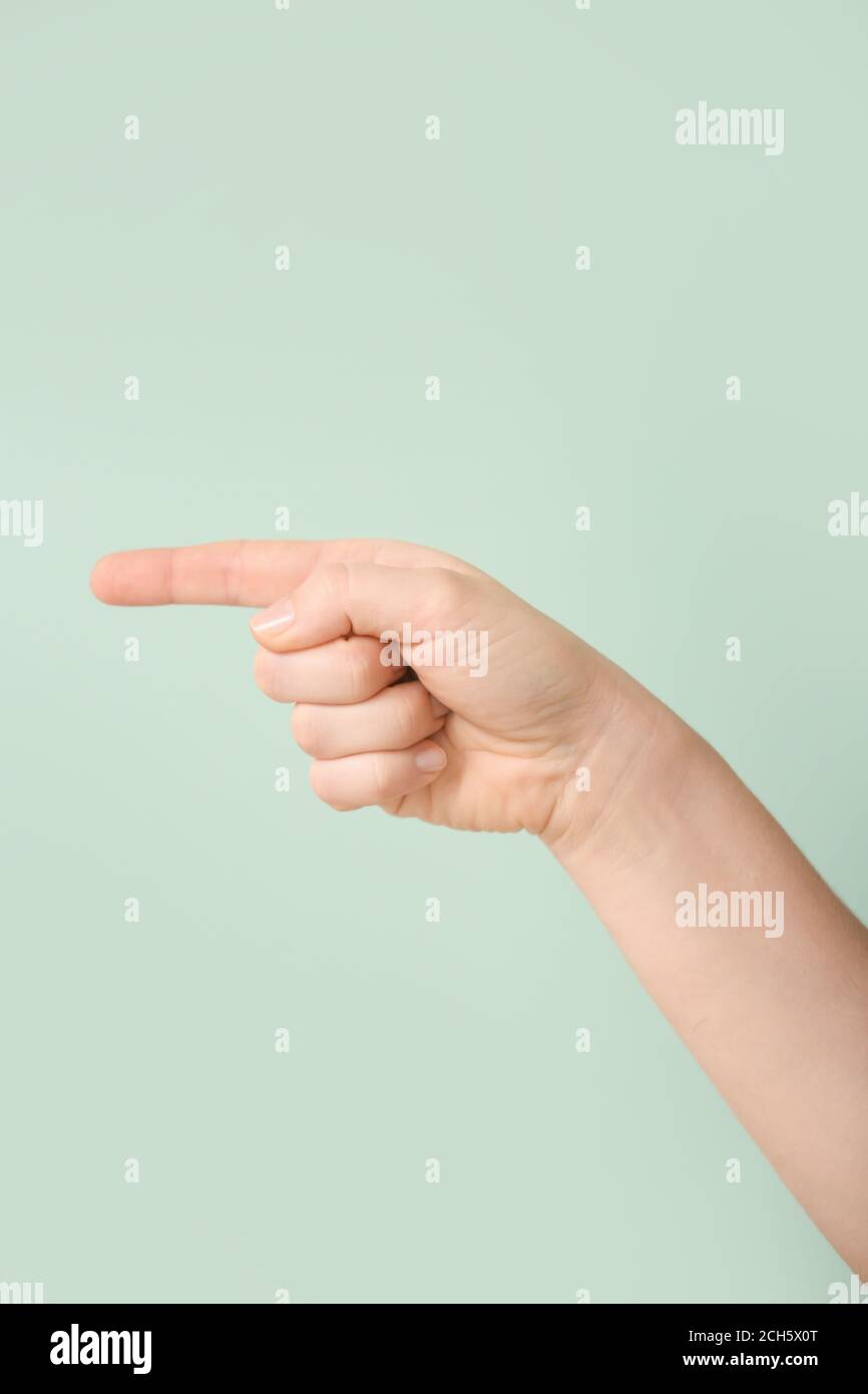 Hand showing letter G on color background. Sign language alphabet Stock ...