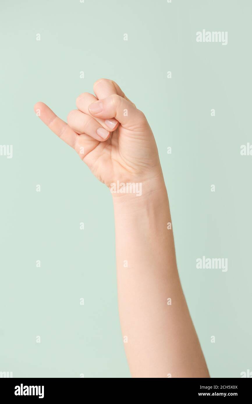 Hand showing letter J on color background. Sign language alphabet Stock ...