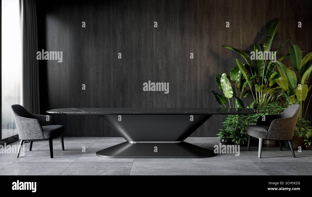 Black wall with large table and plants Stock Photo - Alamy