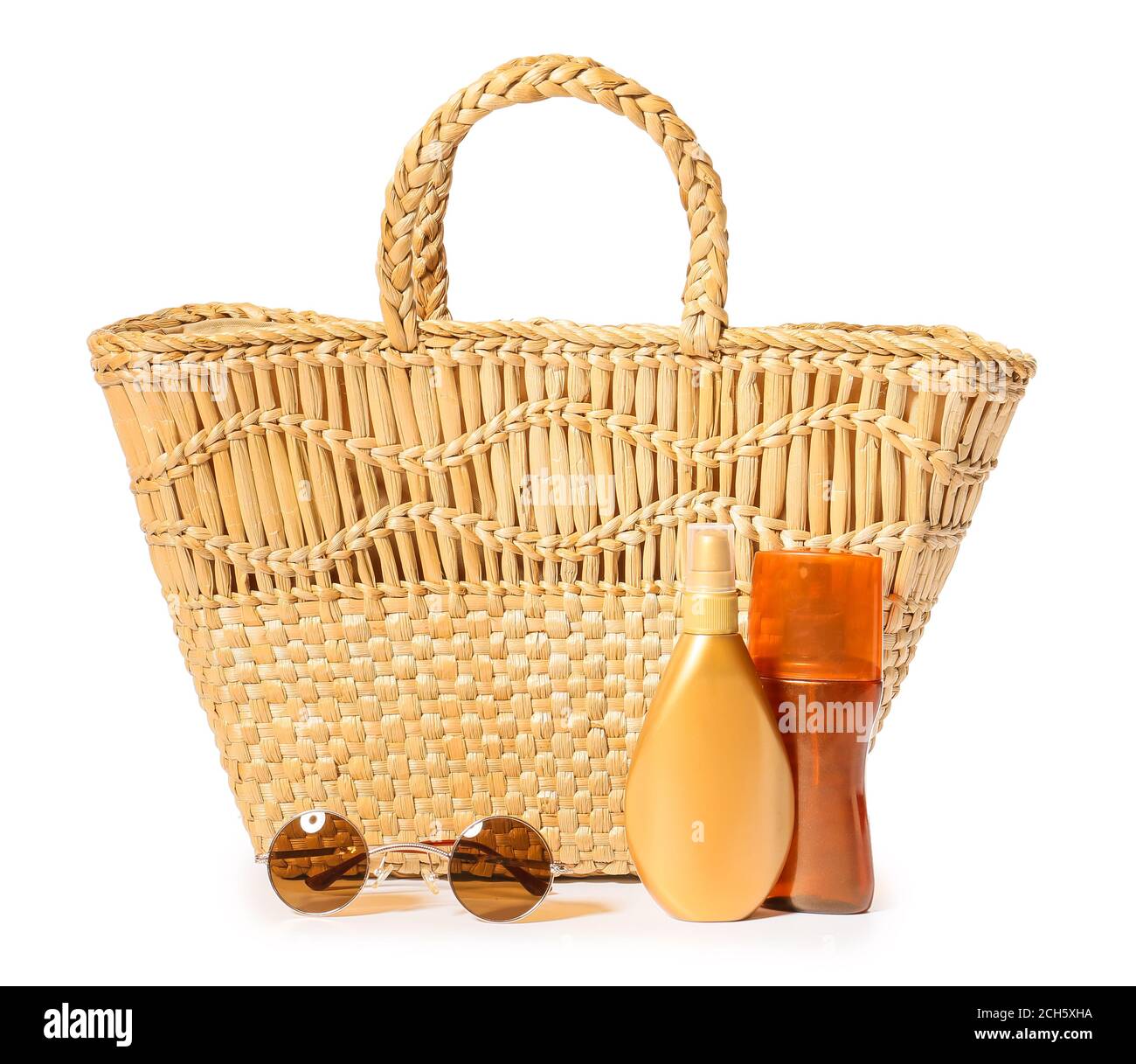 Beach bag with sunscreen cream and sunglasses on white background Stock ...