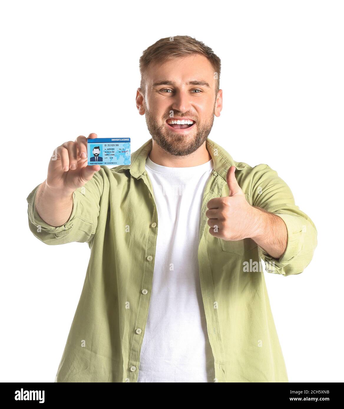 Happy young man with driving license on white background Stock Photo ...