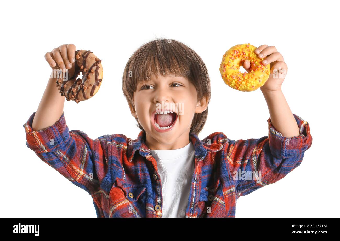 Funny little boy with donuts on white background Stock Photo - Alamy
