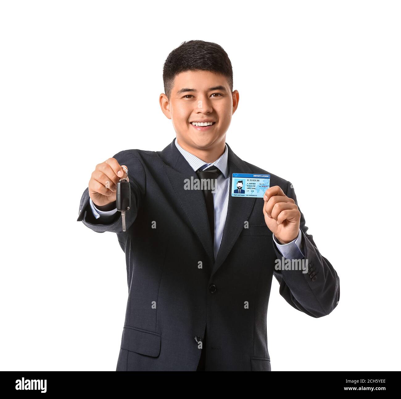 Happy Asian businessman with car key and driving license on white ...