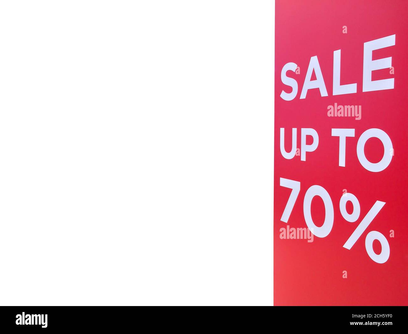 Sale sign text or sale banner on red wall at a retail shopping mall ...