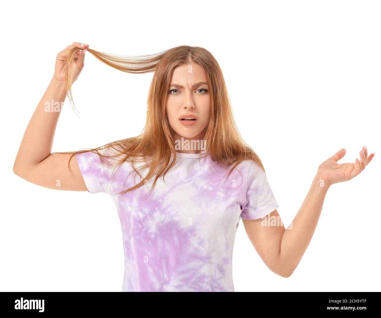 Stressed woman with hair problem on white background Stock Photo - Alamy