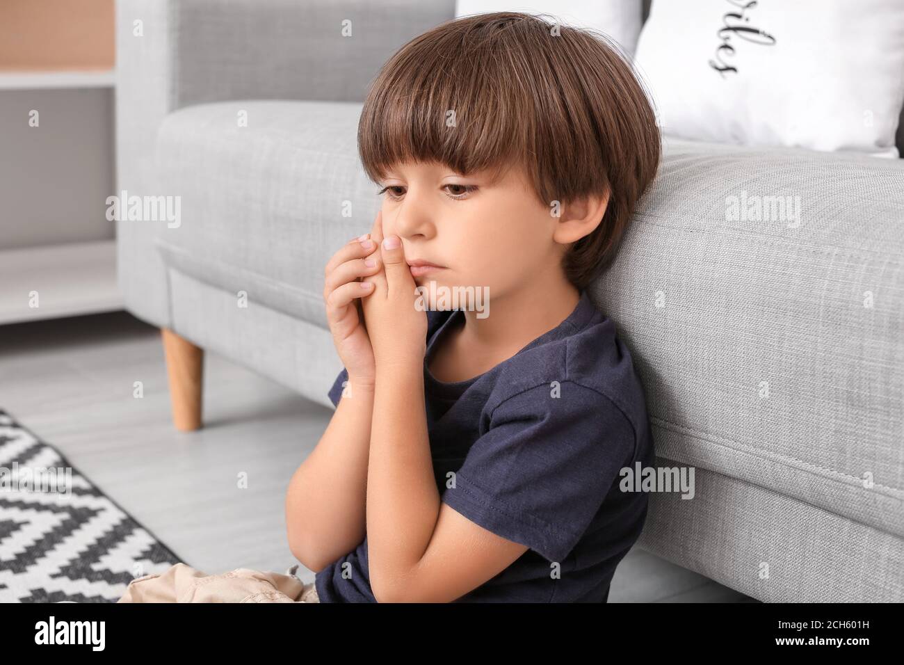 Little boy suffering from tooth ache at home Stock Photo - Alamy