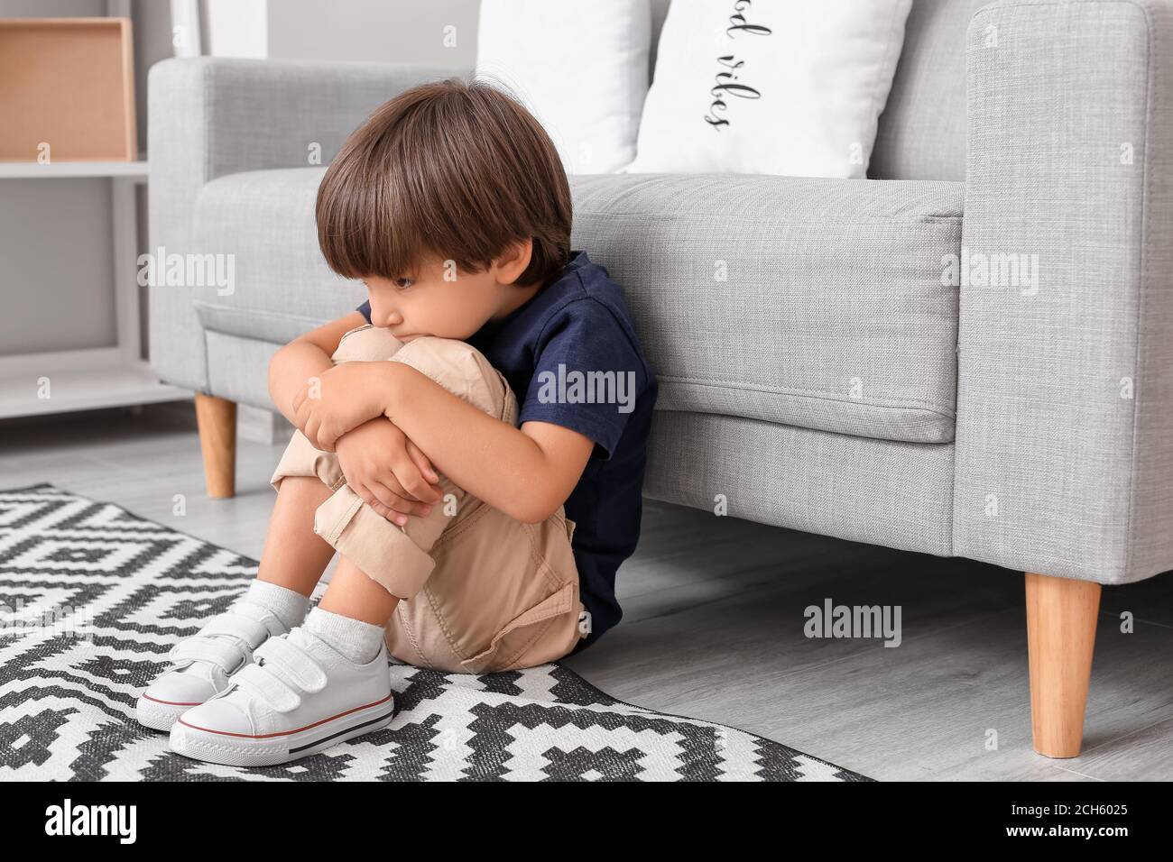 Little boy with autistic disorder at home Stock Photo - Alamy