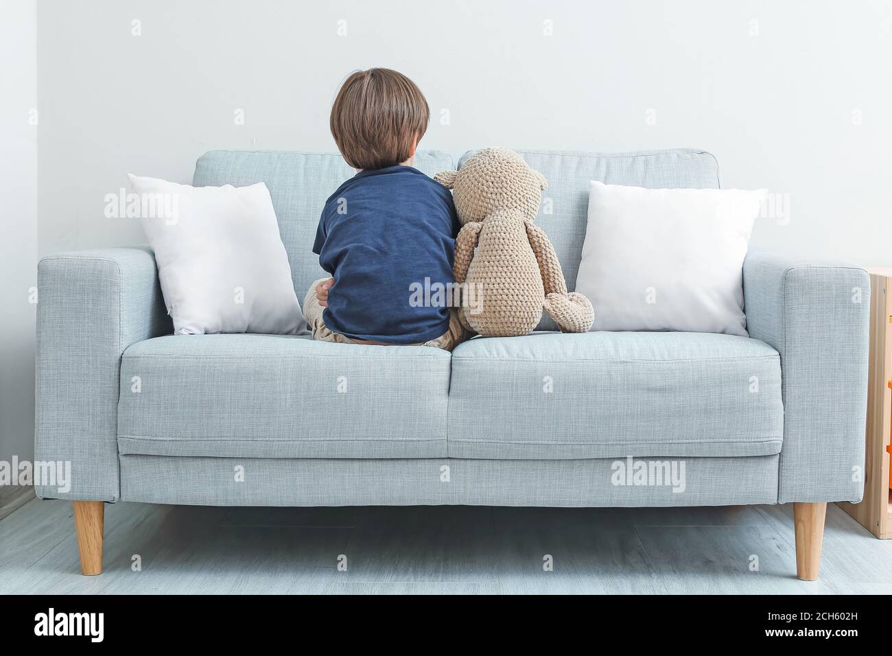 Sad little boy with autistic disorder at home Stock Photo - Alamy
