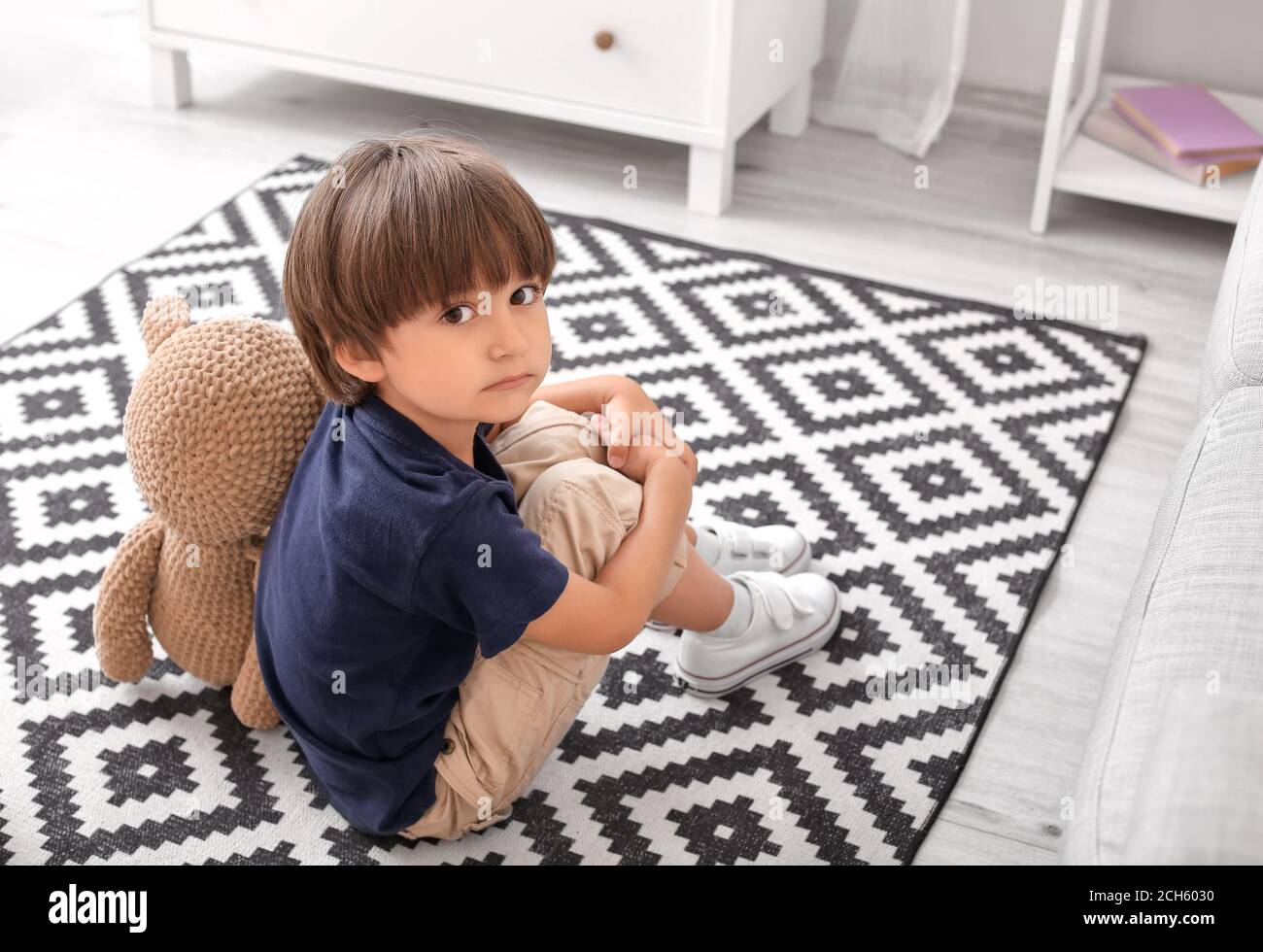 Little boy with autistic disorder at home Stock Photo - Alamy