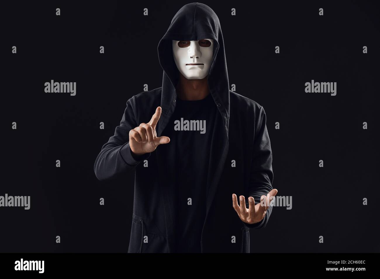 Professional hacker using virtual screen on dark background Stock Photo ...