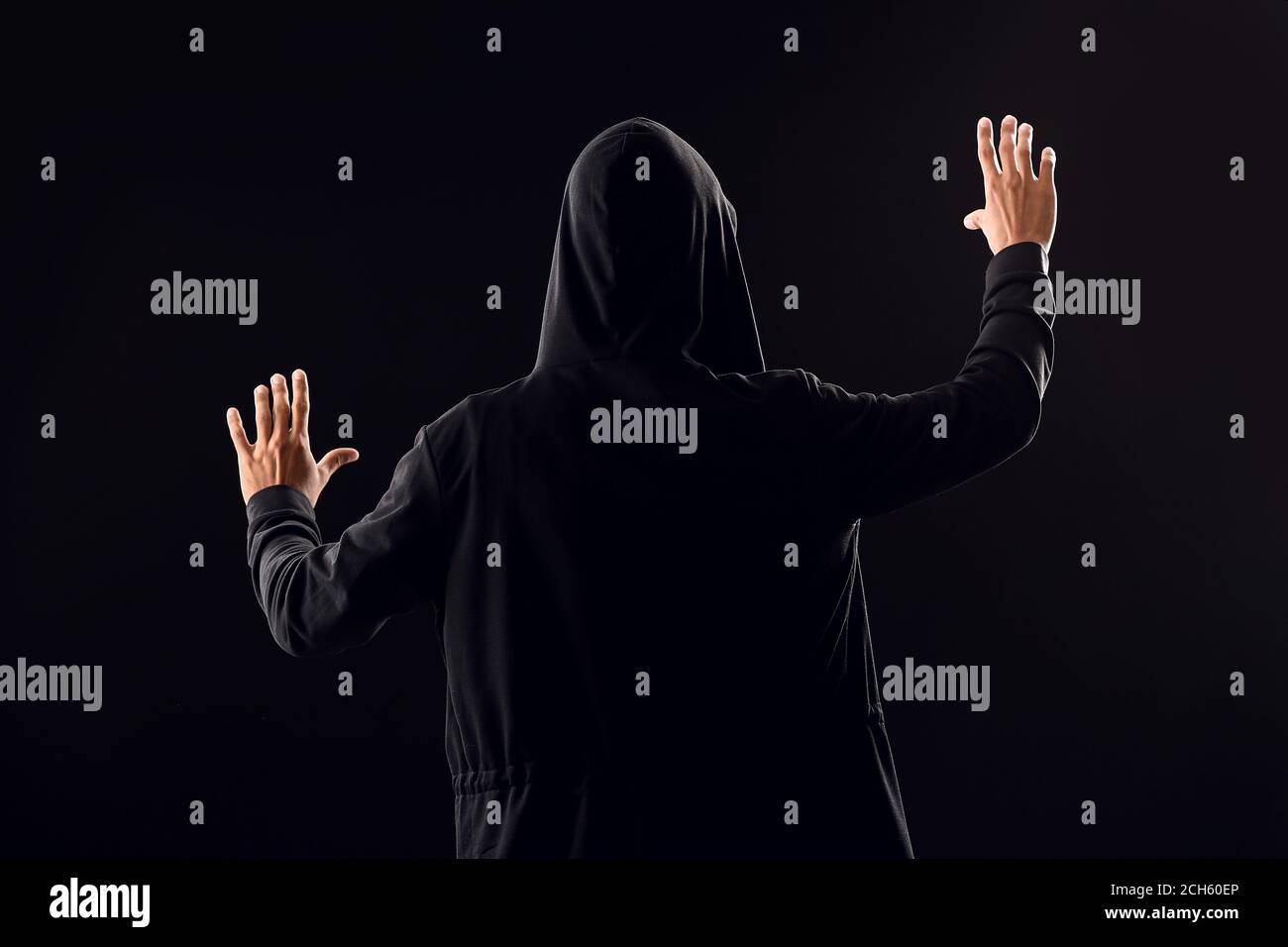 Professional hacker using virtual screen on dark background, back view ...