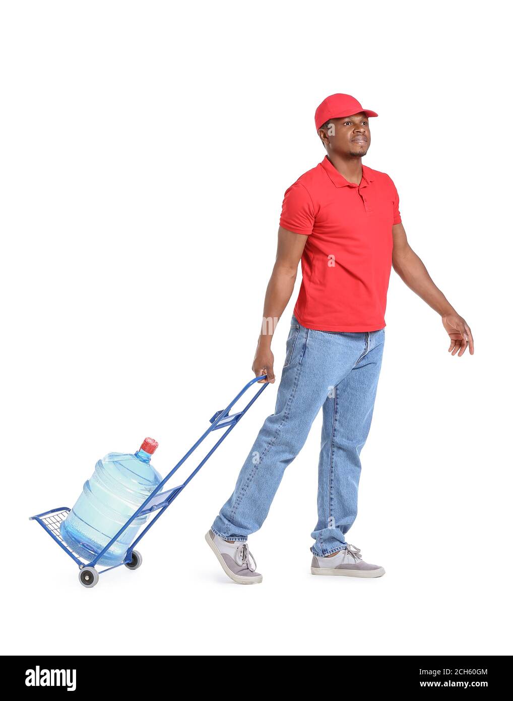 African-American delivery man with bottle of water on white background ...