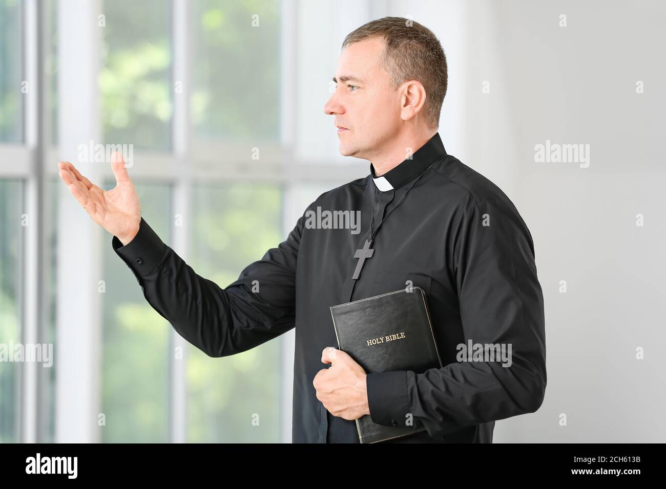 Portrait of male priest at home Stock Photo - Alamy