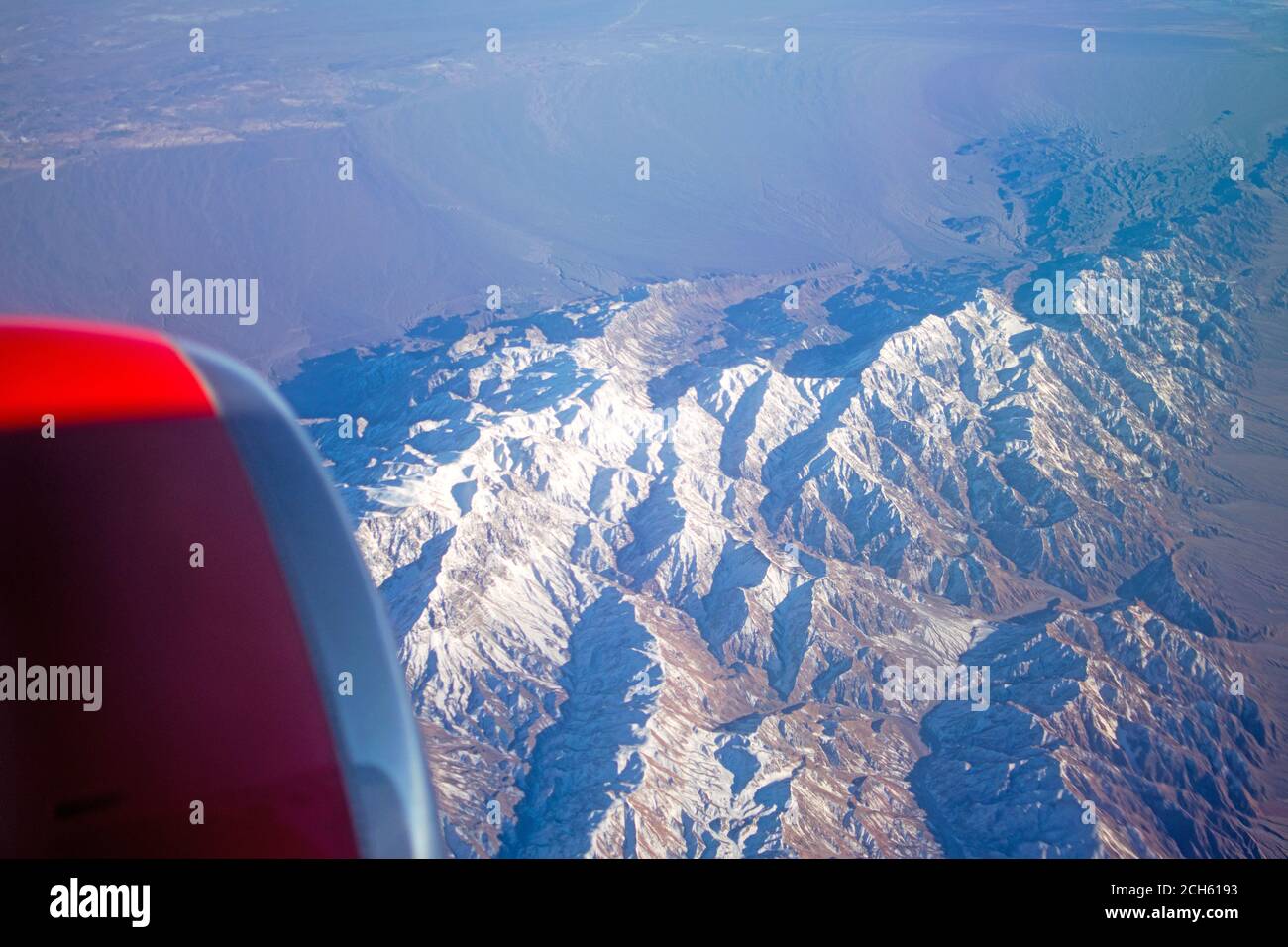 Beautiful winter mountains from the plane window Stock Photo - Alamy