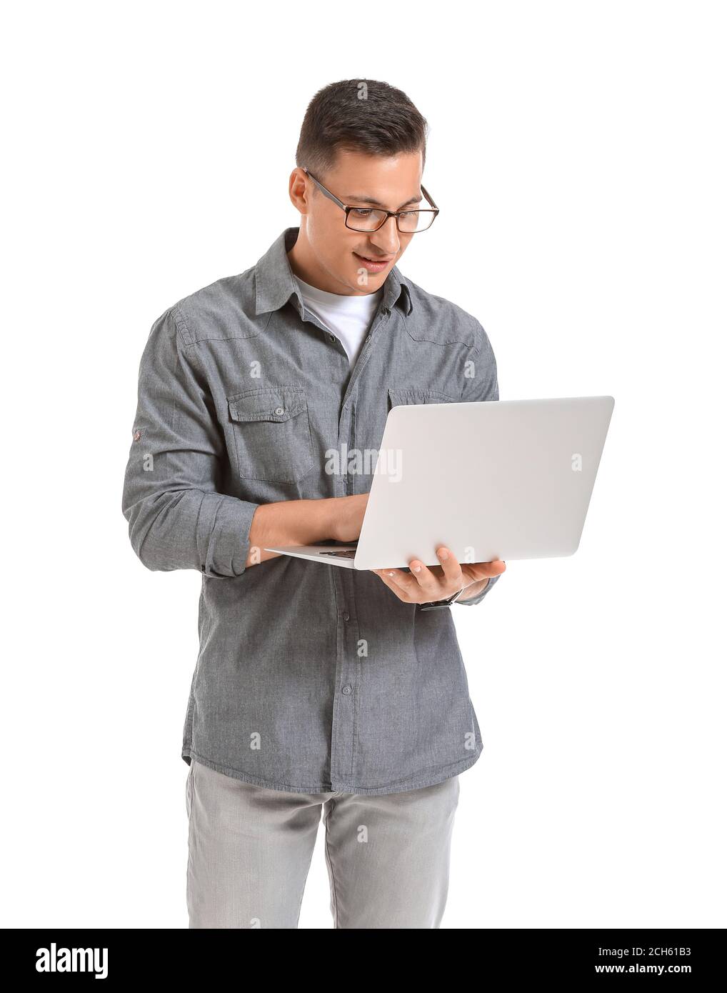 Male programmer with laptop on white background Stock Photo - Alamy