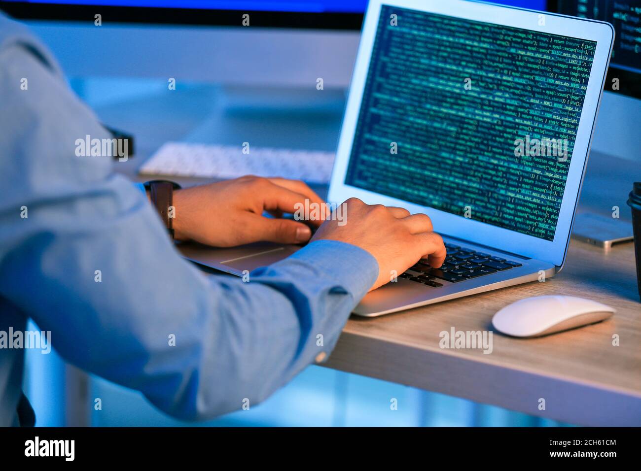 Male programmer working in office at night Stock Photo - Alamy
