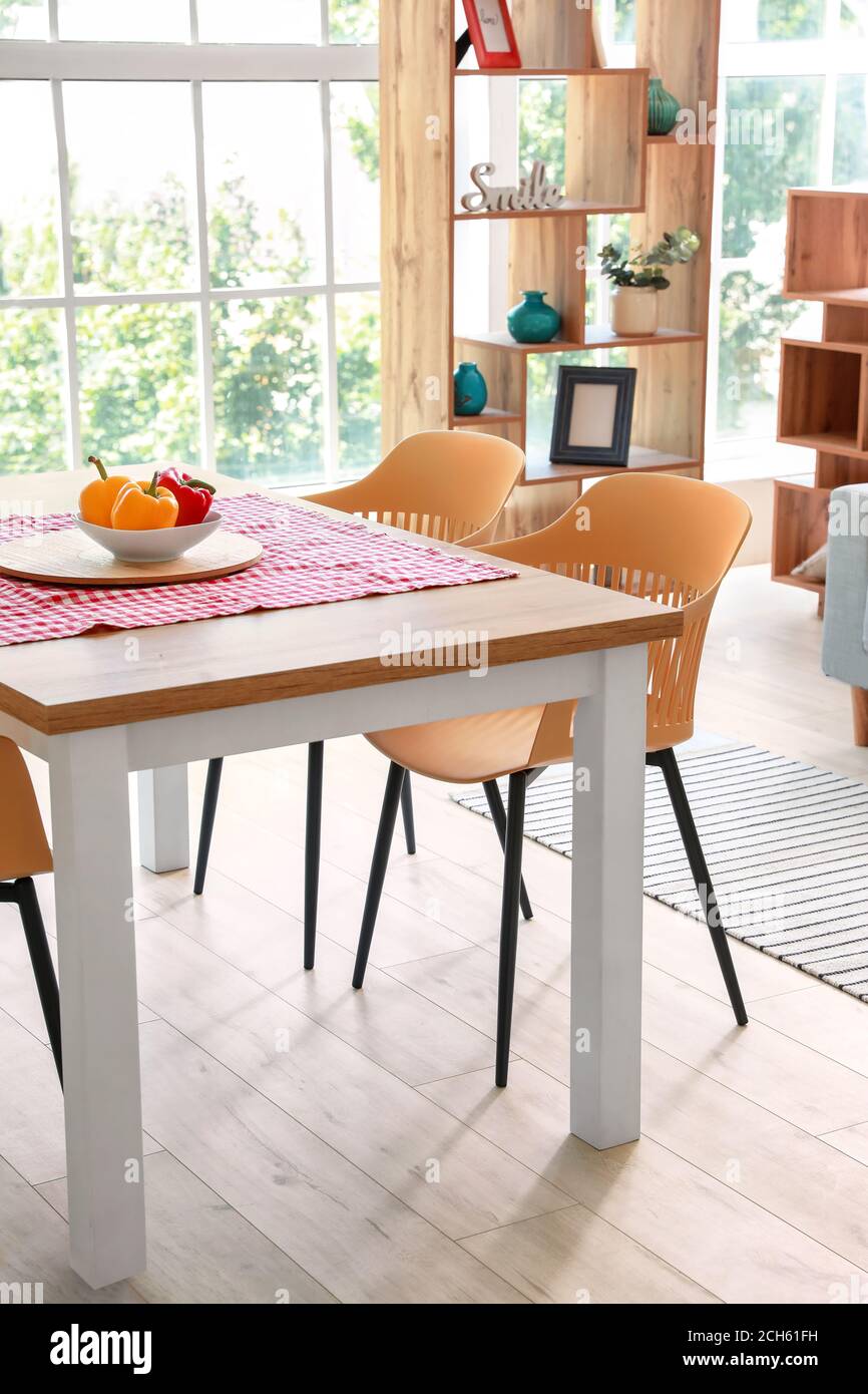 Dining table in interior of modern room Stock Photo - Alamy