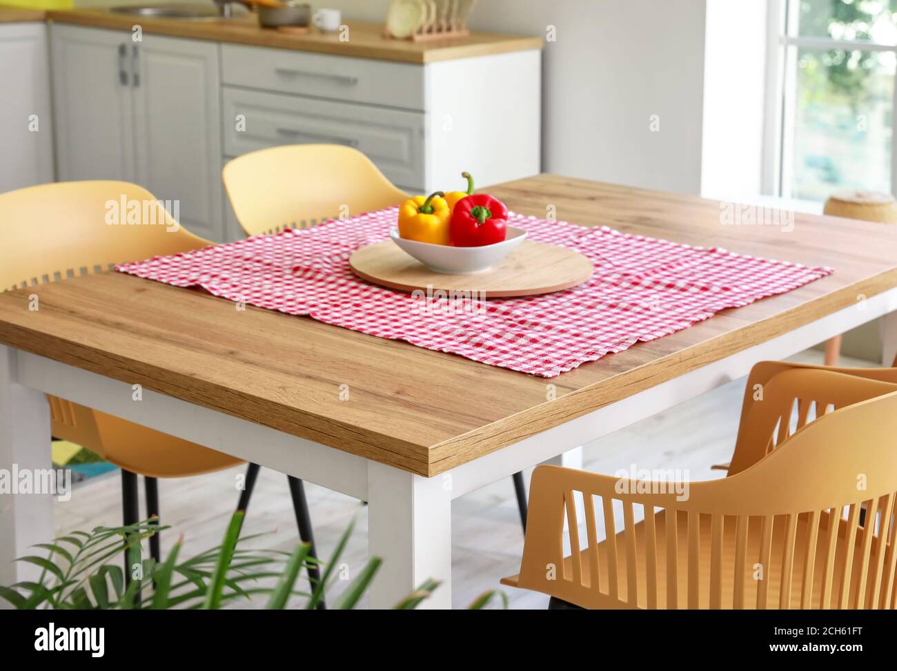 Dining table in interior of modern kitchen Stock Photo - Alamy