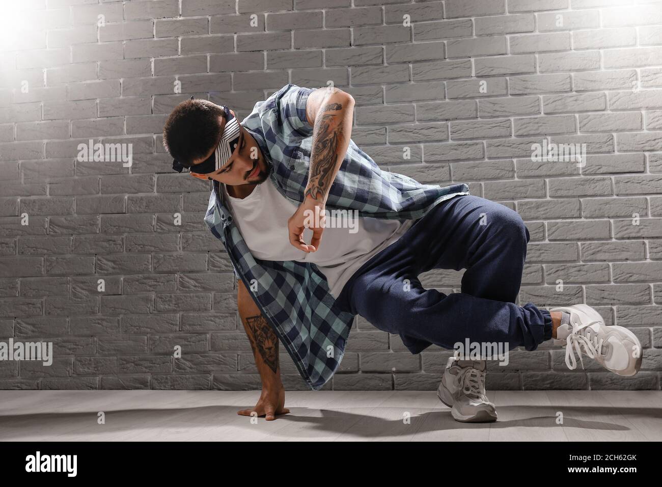 Male hip-hop dancer in studio Stock Photo - Alamy