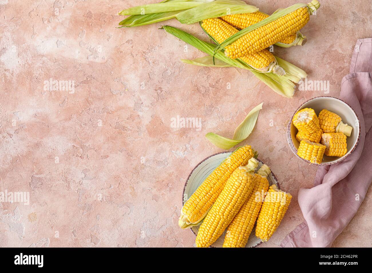 Fresh corn cobs on color background Stock Photo - Alamy