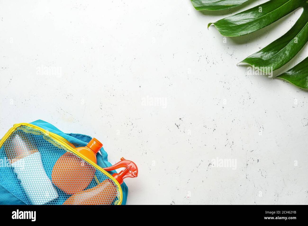 Bag with sunscreen cream on white background Stock Photo - Alamy