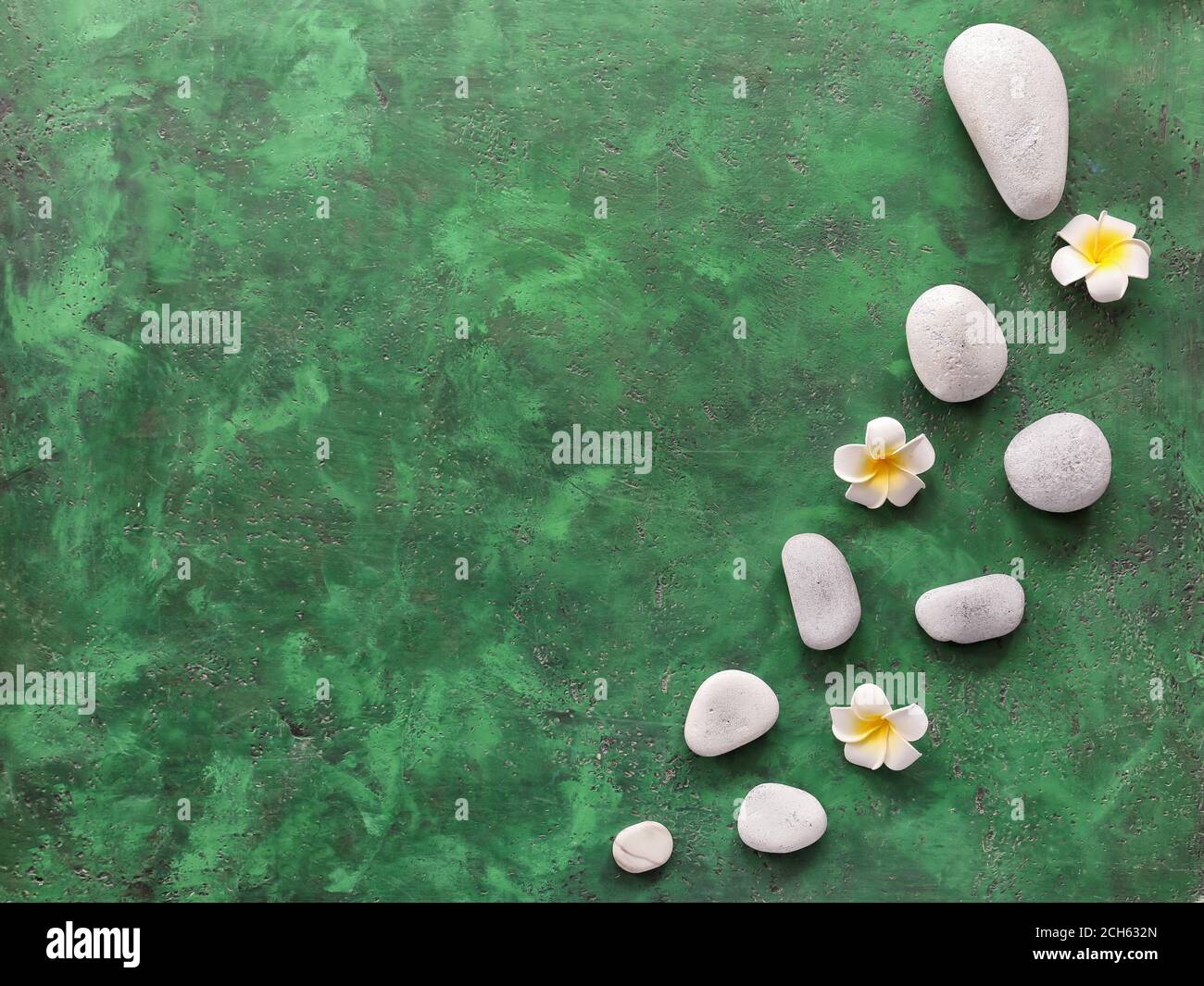 Spa stones and flowers on color background. Zen concept Stock Photo - Alamy