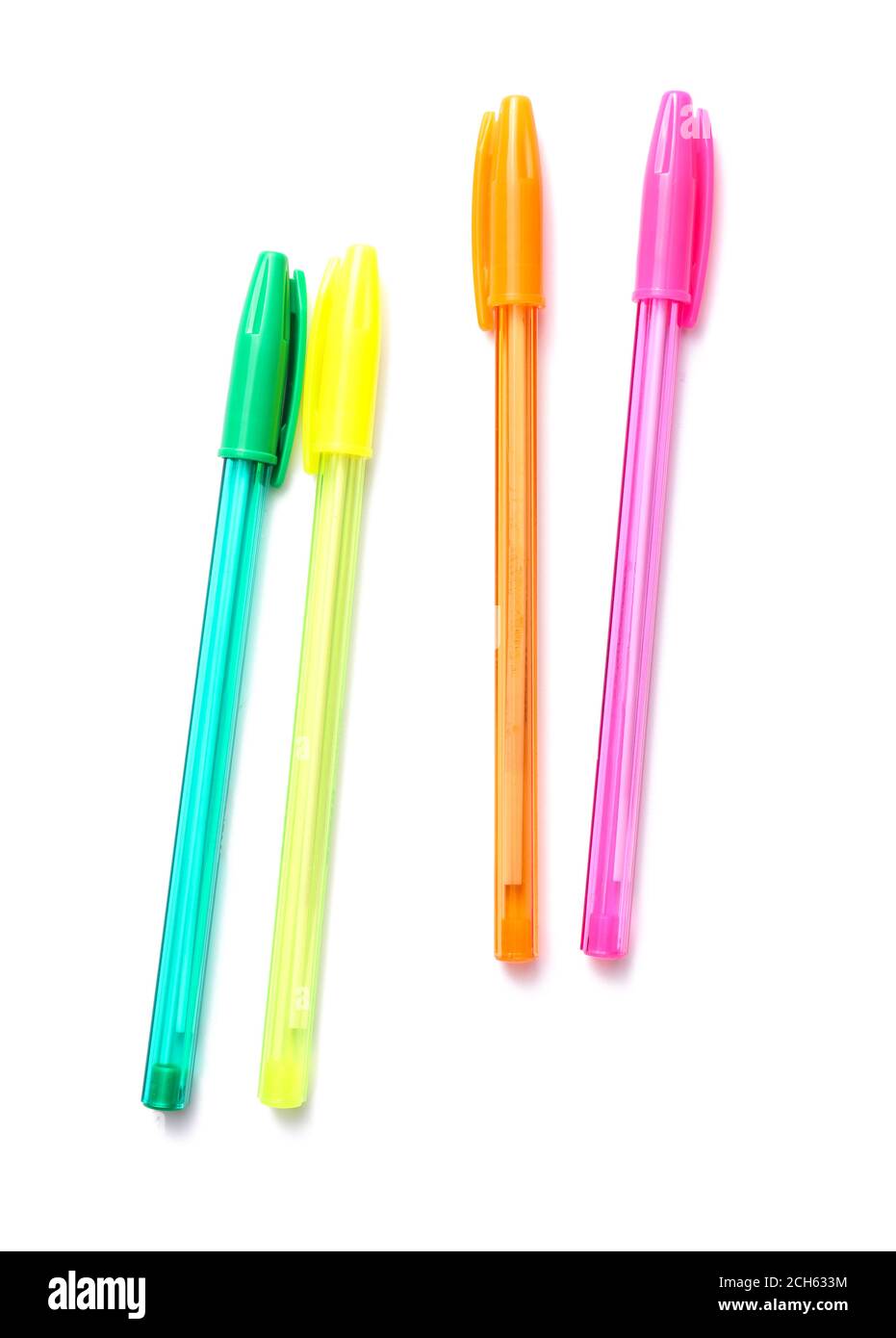 Different pens on white background Stock Photo - Alamy