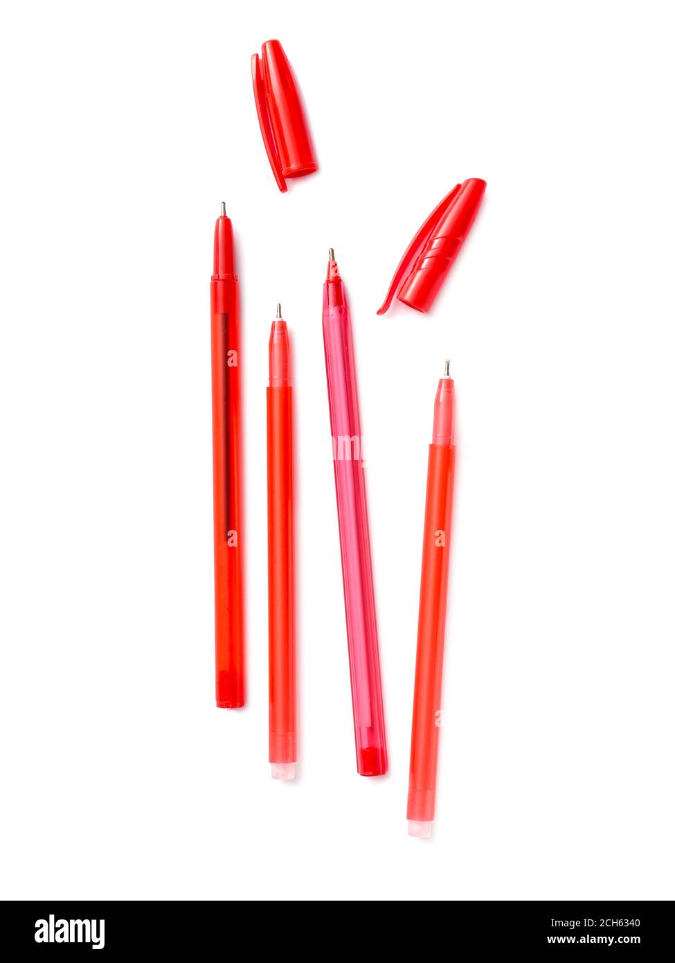 Different pens on white background Stock Photo - Alamy