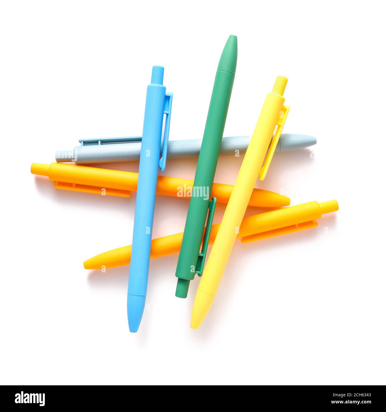 Different pens on white background Stock Photo - Alamy