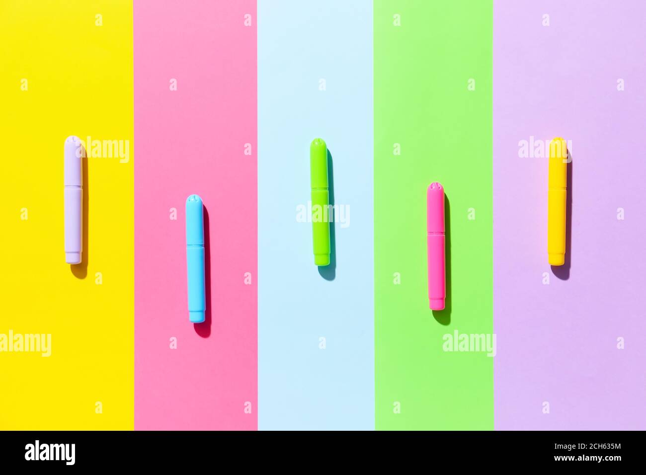 Different markers on color background Stock Photo - Alamy