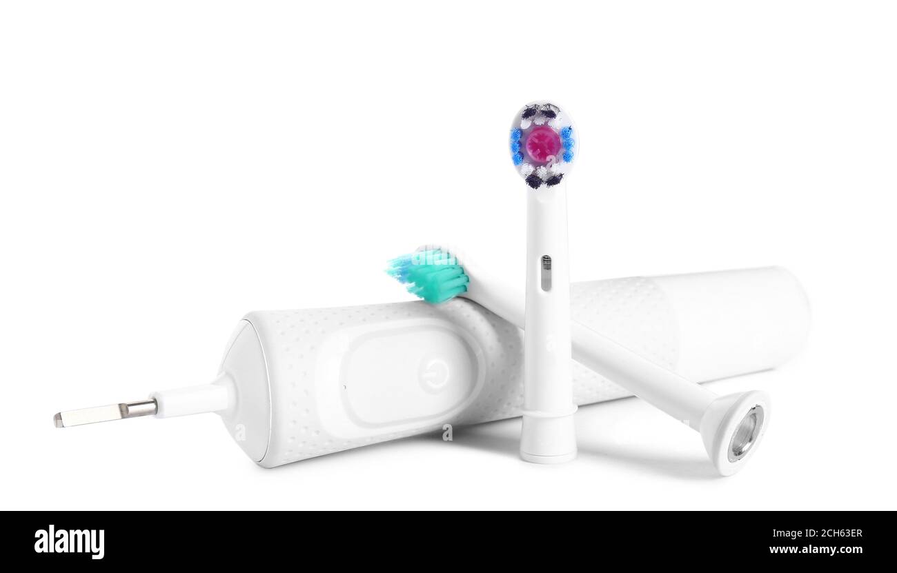 Electric tooth brush with attachments on white background Stock Photo ...