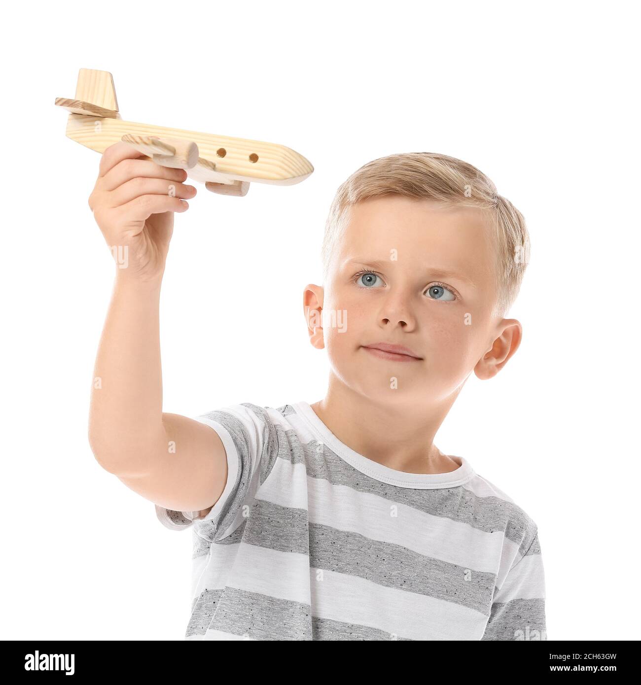 Little boy with autistic disorder playing with toy on white background ...