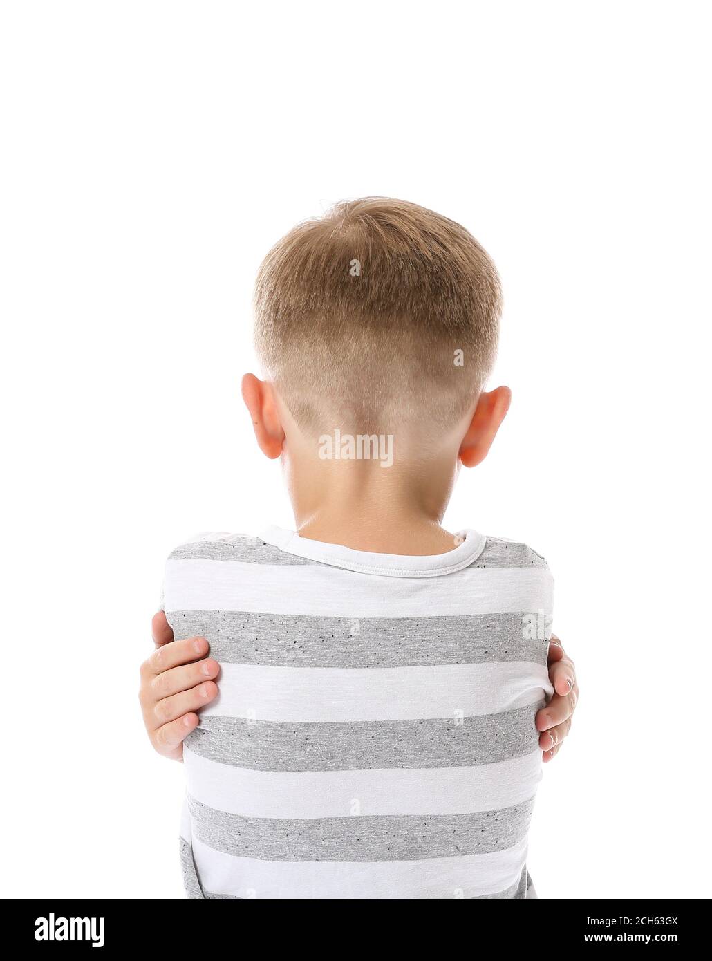 Sad little boy with autistic disorder on white background, back view ...