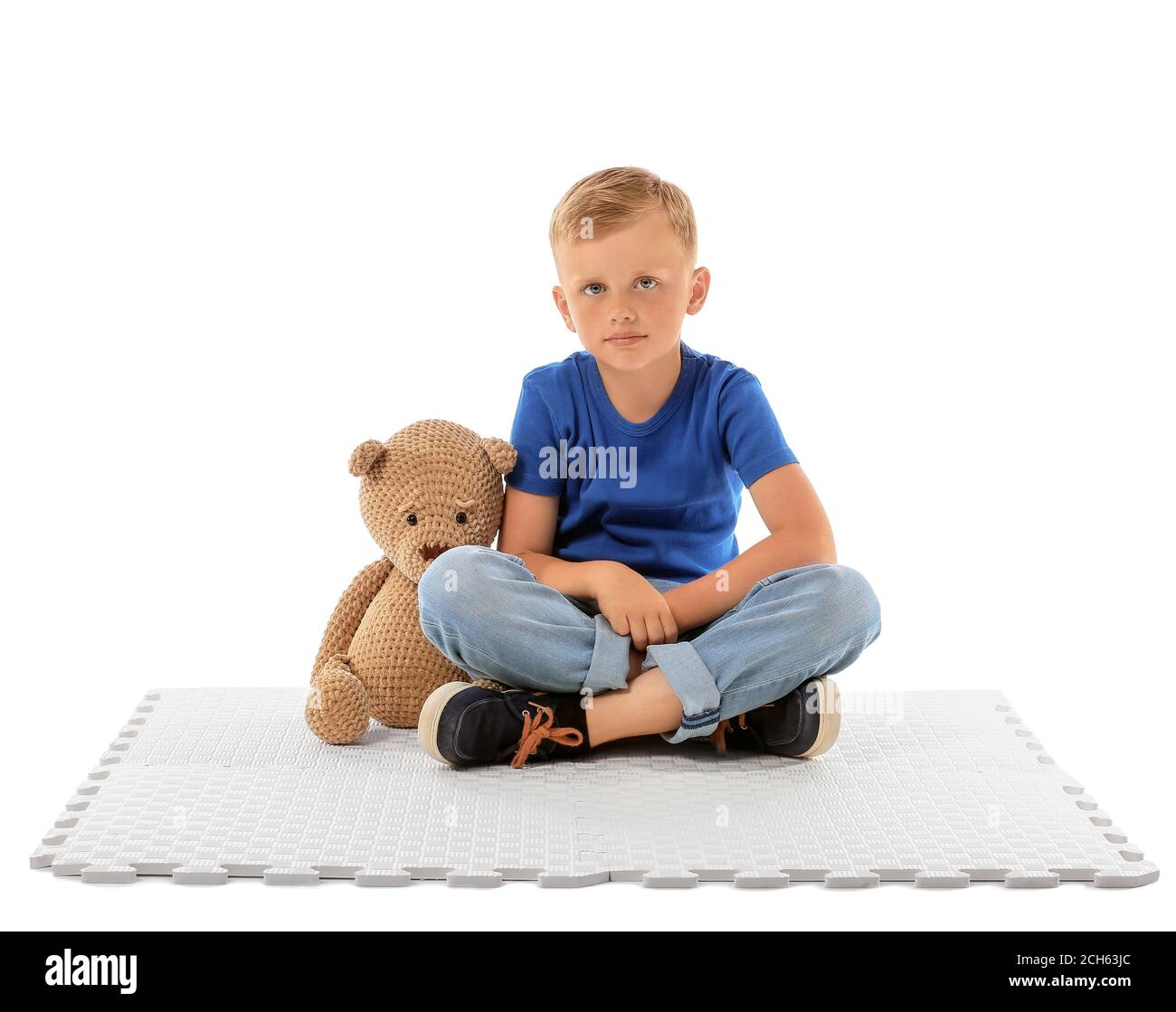 Little boy with autistic disorder and toy on white background Stock ...