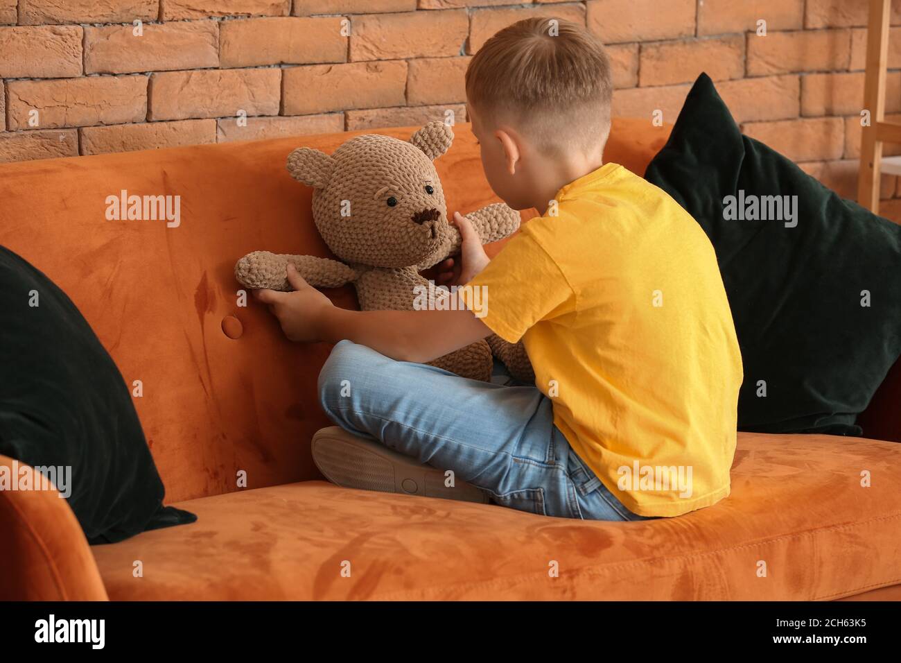 Little boy with autistic disorder playing with toy at home Stock Photo ...
