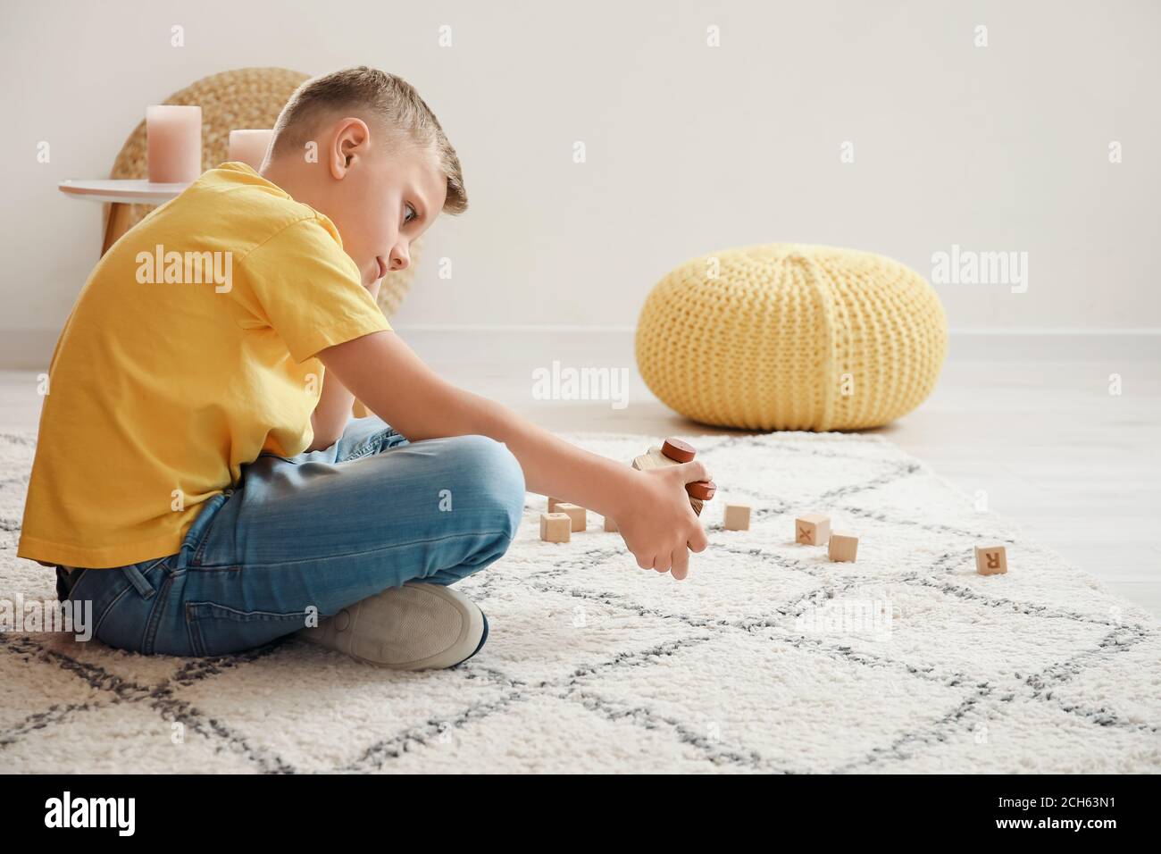 Little boy with autistic disorder playing with toy at home Stock Photo ...