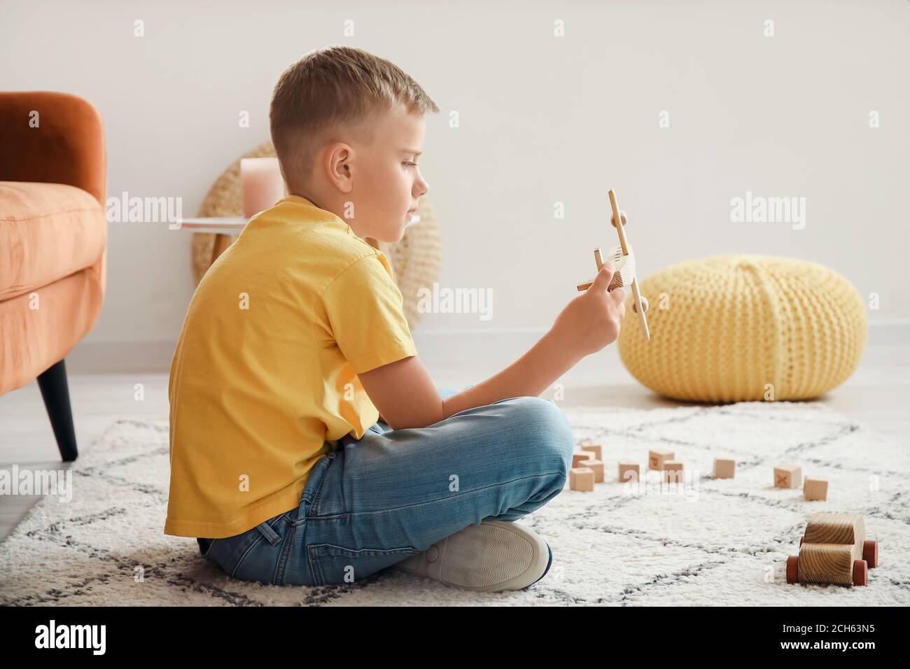 Little boy with autistic disorder playing with toy at home Stock Photo ...