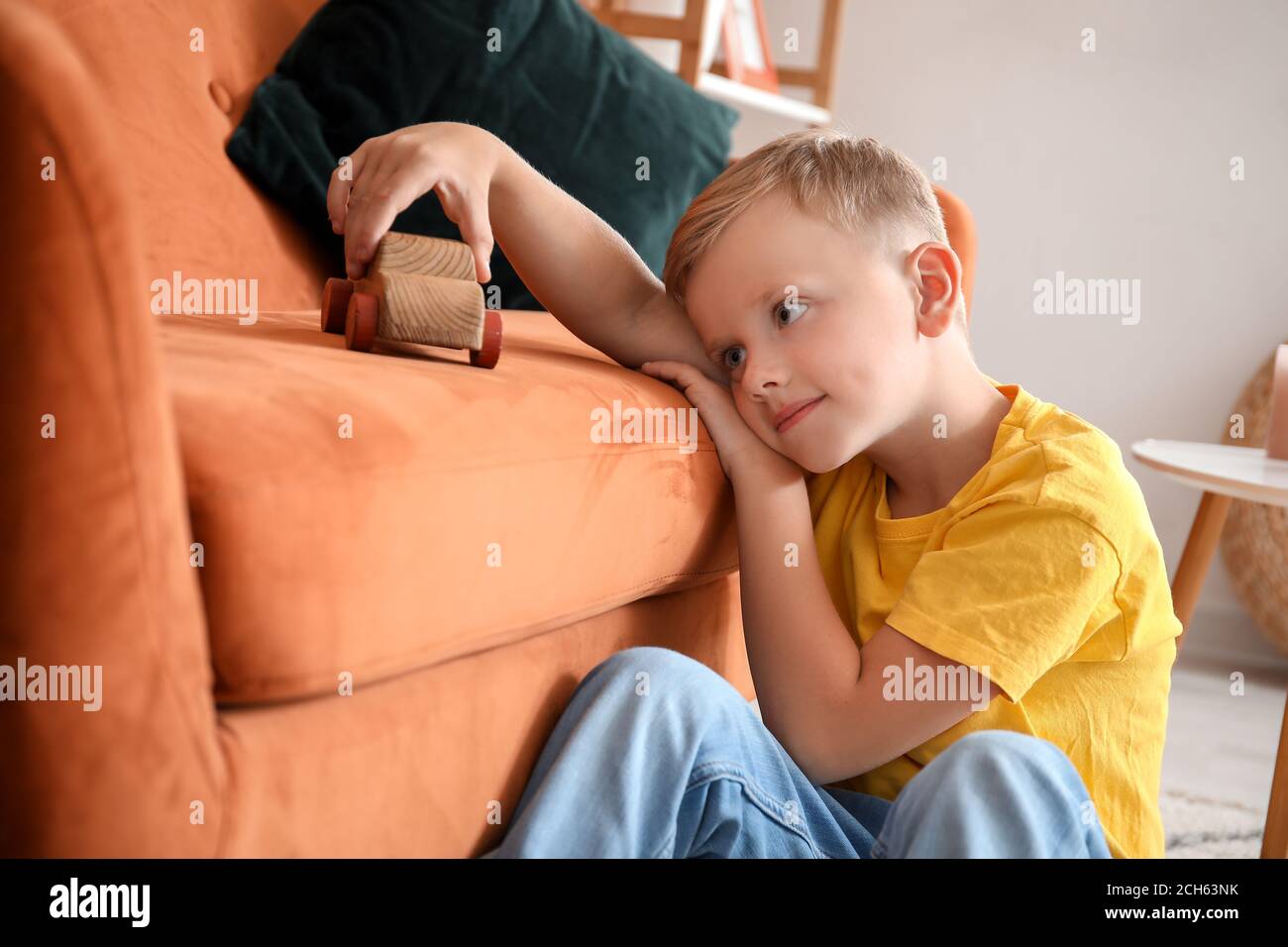 Little boy with autistic disorder playing with toy at home Stock Photo ...