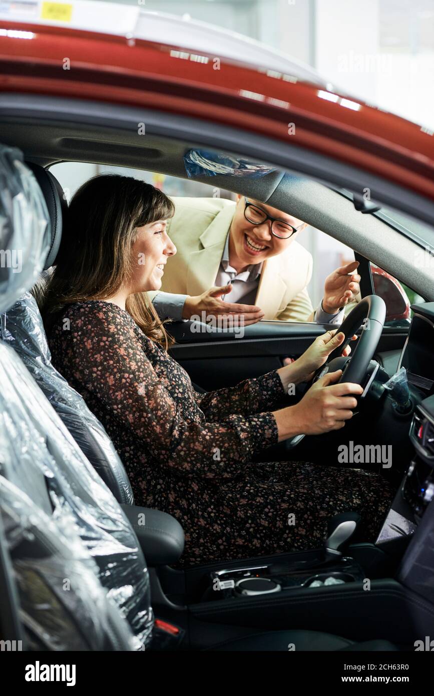 Woman testing new car Stock Photo - Alamy