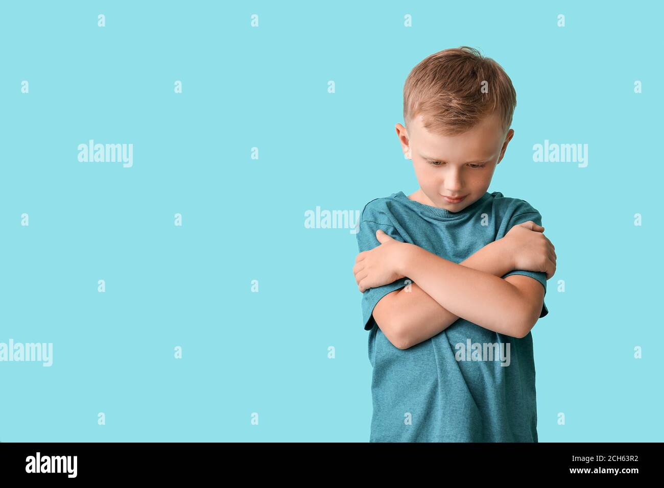 Sad little boy with autistic disorder on color background Stock Photo ...