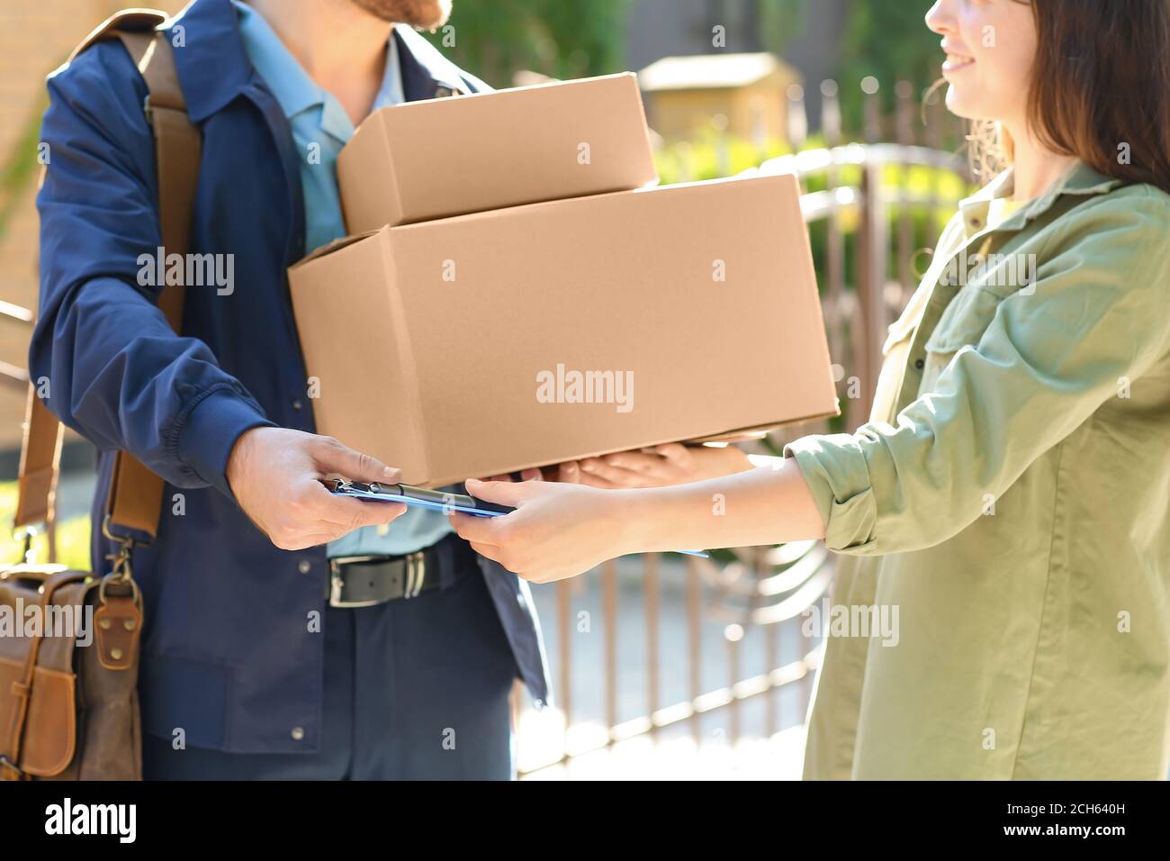 Postman parcel girl hi-res stock photography and images - Alamy