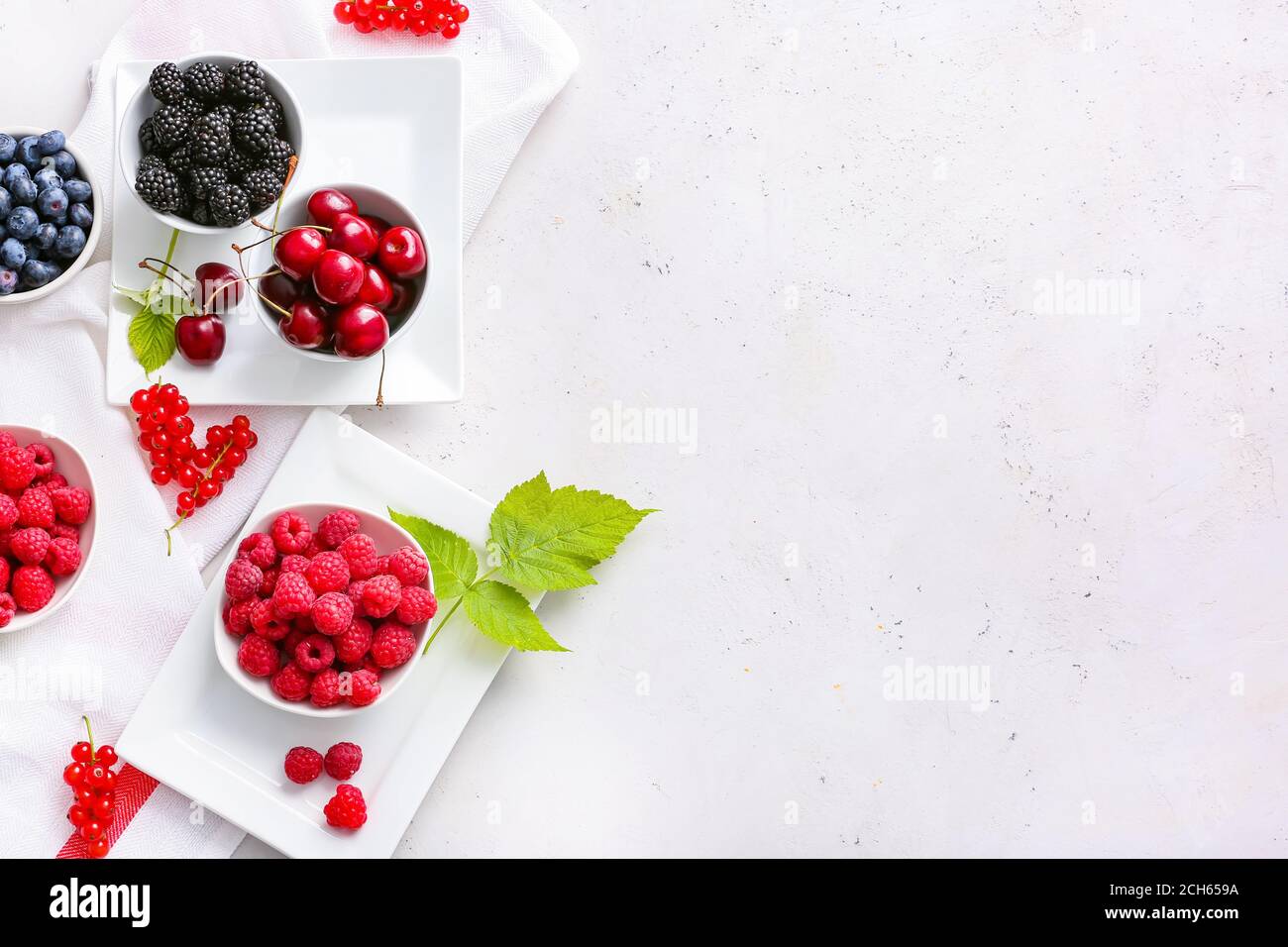 Tasty fresh berries on white background Stock Photo - Alamy