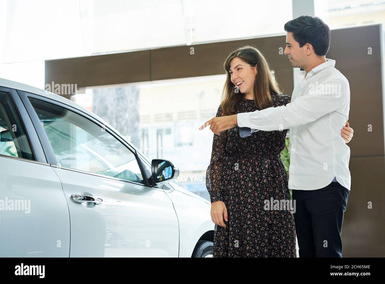 Man buying a car for his wife Stock Photo - Alamy