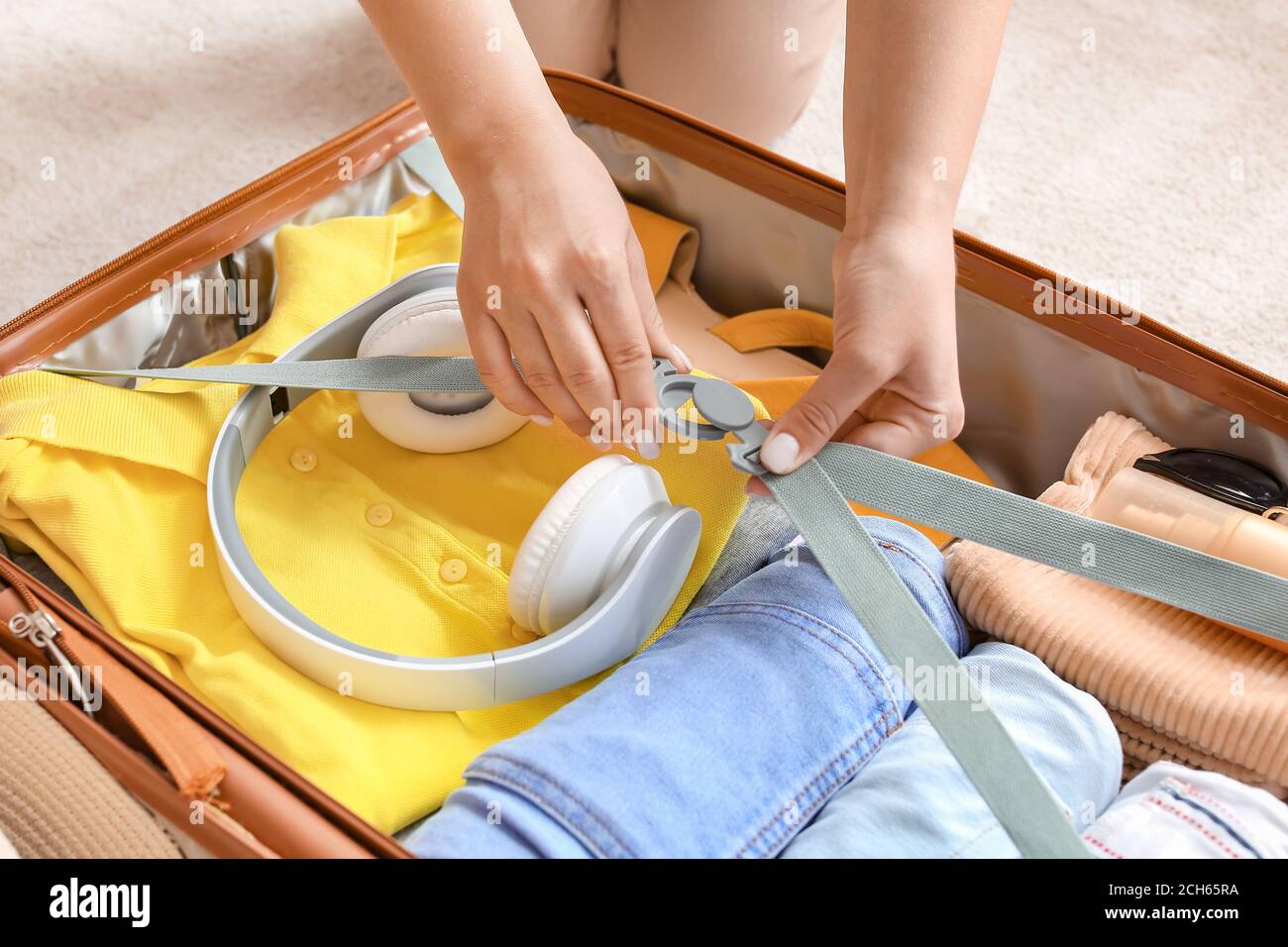 Woman packing suitcase at home. Travel concept Stock Photo - Alamy