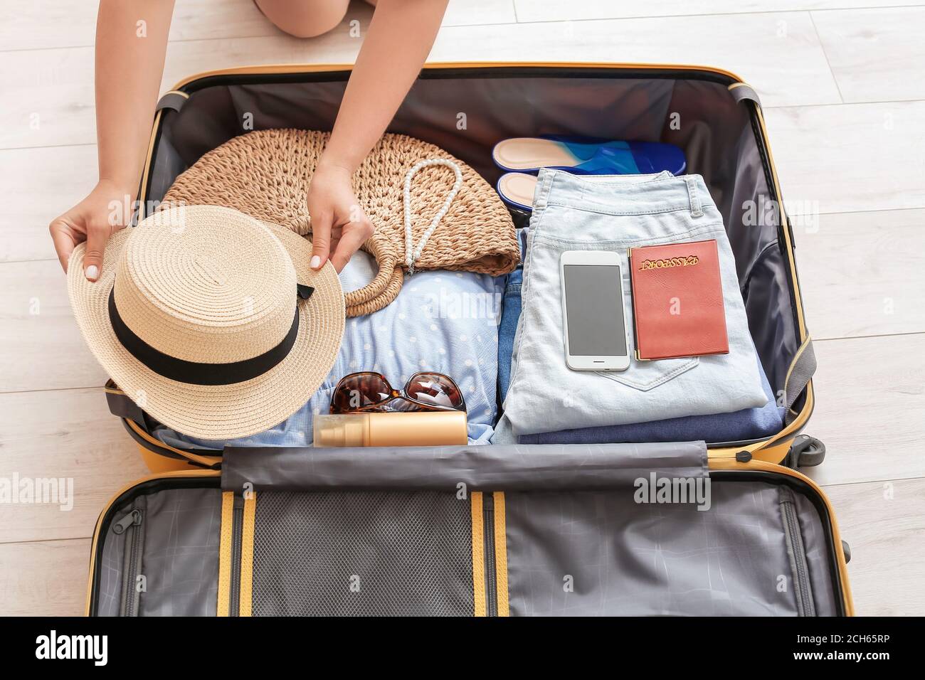 Woman packing suitcase at home. Travel concept Stock Photo - Alamy