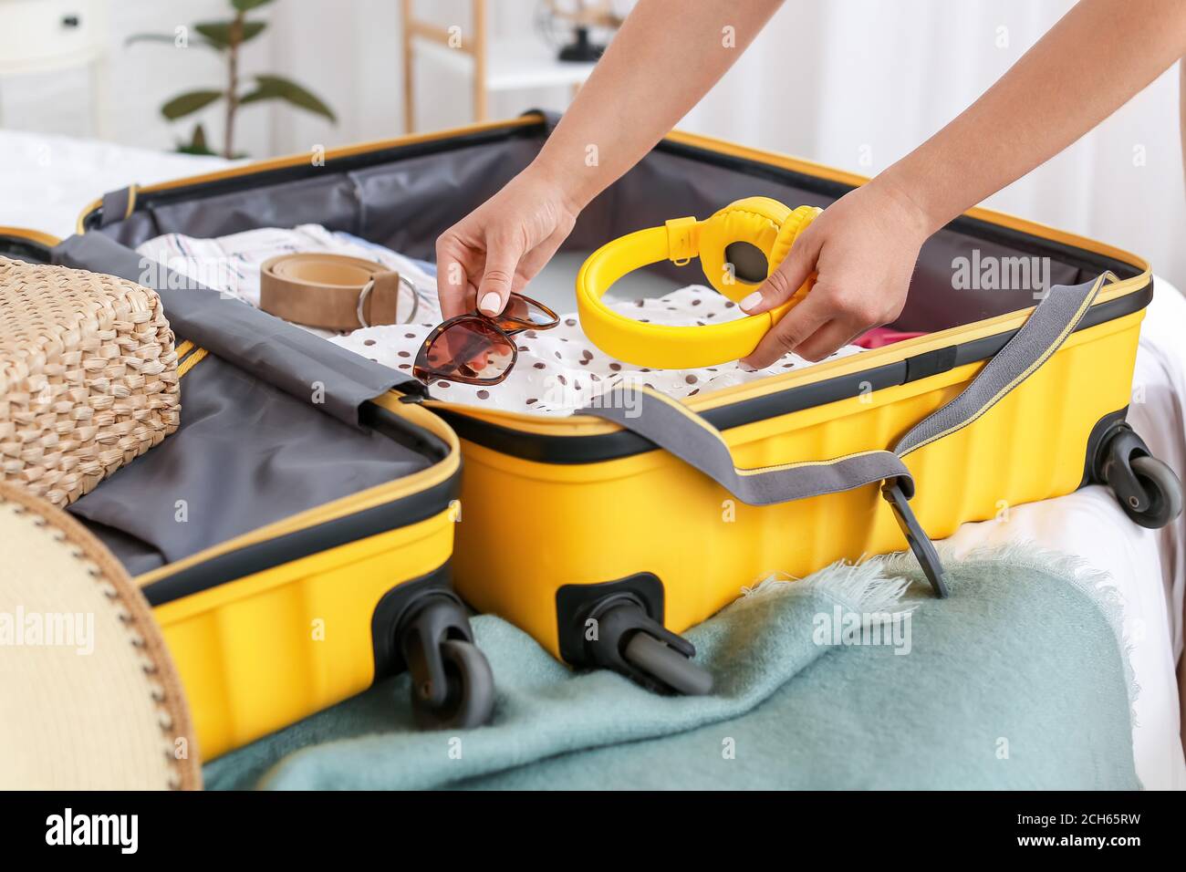 Woman packing suitcase at home. Travel concept Stock Photo - Alamy