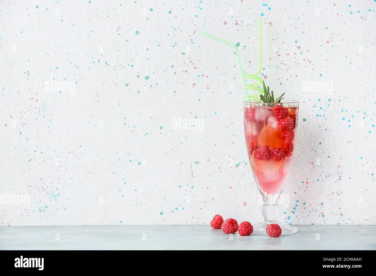 Glass of cold raspberry tea on table Stock Photo - Alamy