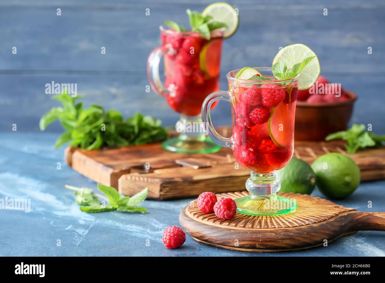 Cup of cold raspberry tea on table Stock Photo - Alamy