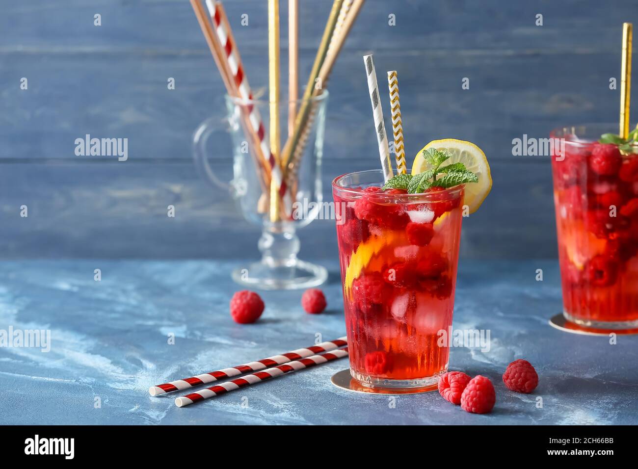 Glass of cold raspberry tea on color background Stock Photo - Alamy