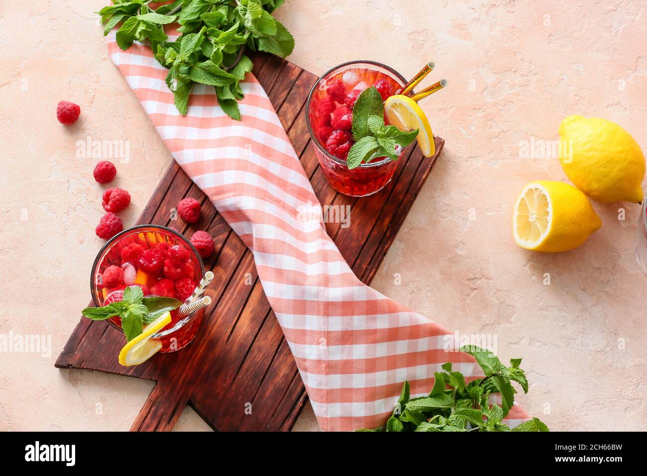 Glasses of cold raspberry tea on color background Stock Photo - Alamy